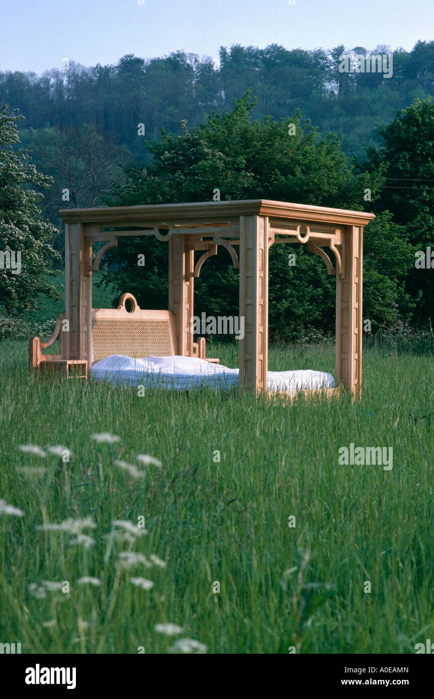Four-poster bed in grass field Stock Photo - Alamy