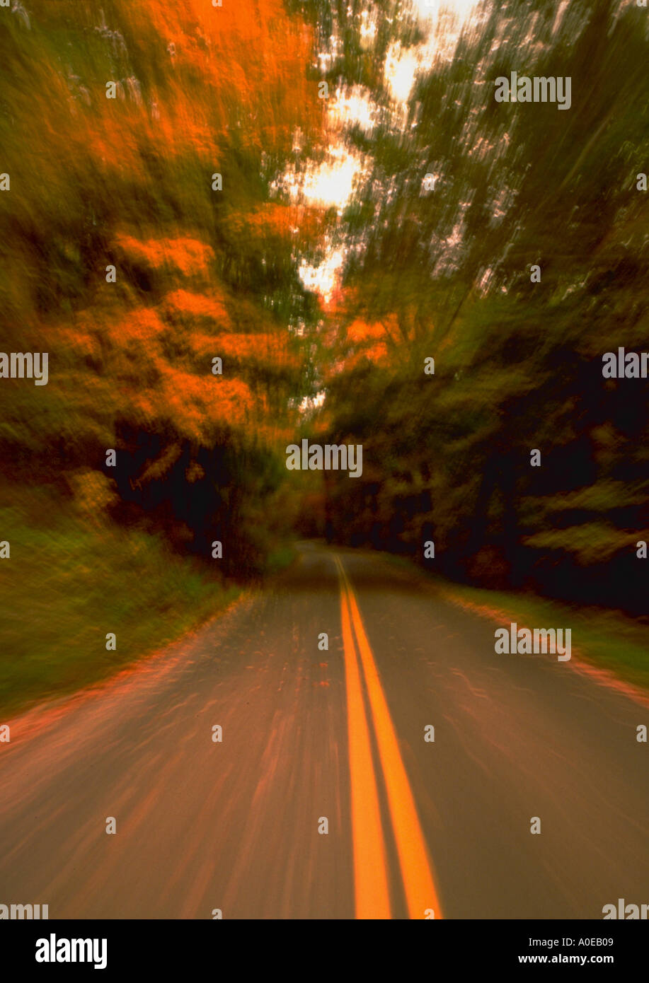 Straight road with blurred motion effect and fall foliage Ohio Stock ...