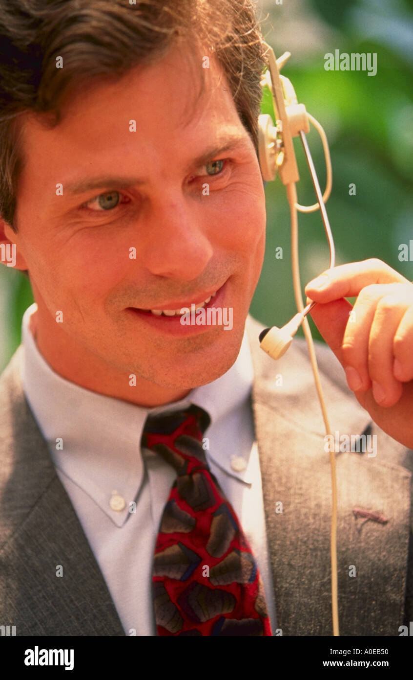 Man using telephone heaset Stock Photo - Alamy