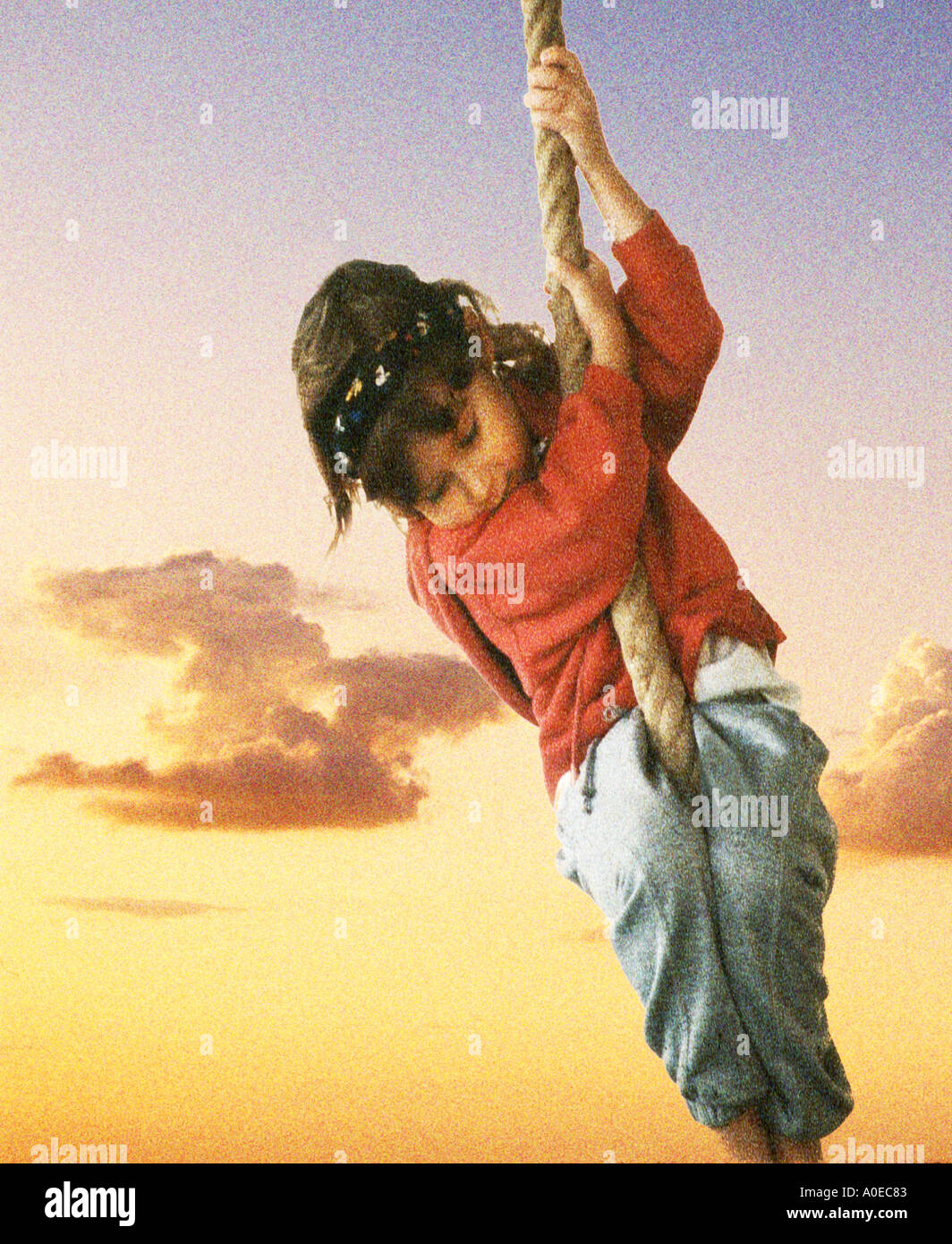 Swinging on a Rope Stock Photo - Alamy