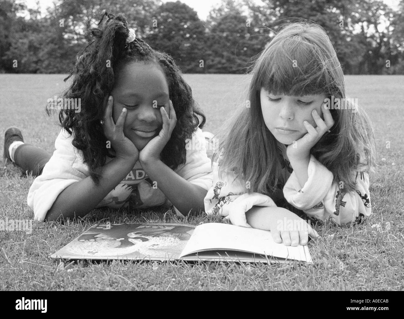 Two Girls Reading Stock Photo - Alamy