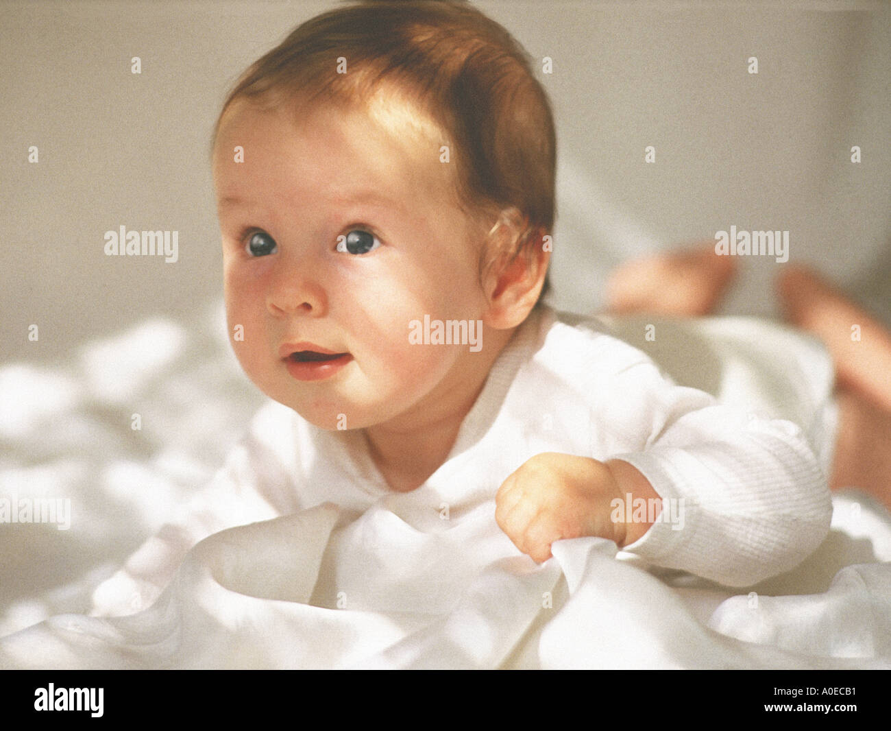 Baby Lying on Stomach Stock Photo - Alamy