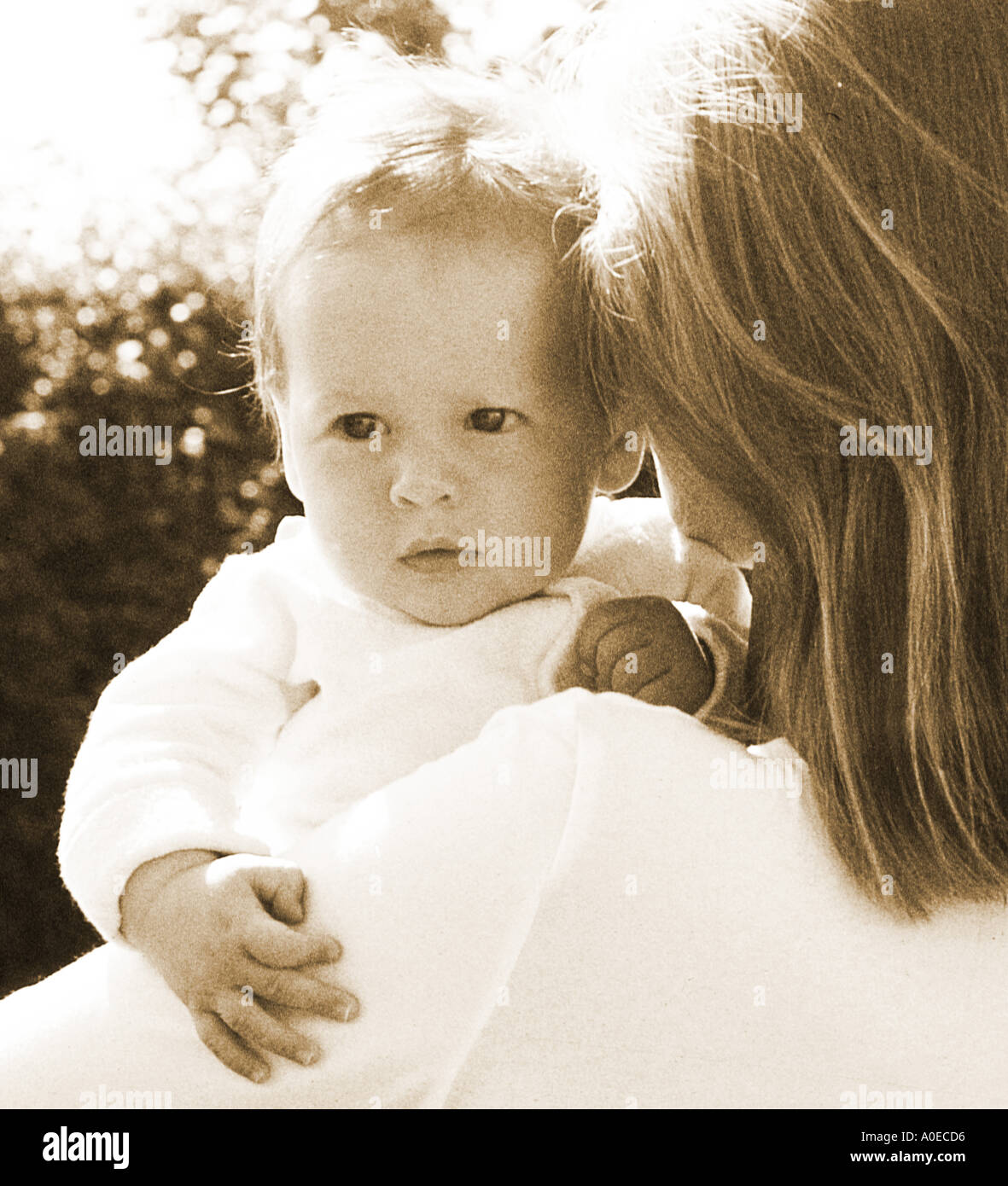Baby Looking Over Mother s Shoulder Stock Photo - Alamy