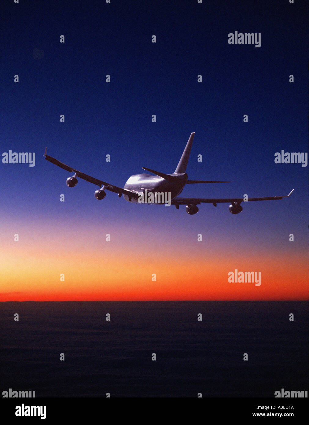 Aircraft Flying Into Sunrise Sunset Stock Photo - Alamy