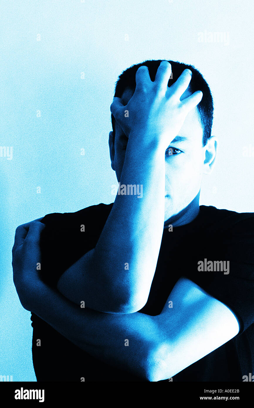 man with his arms wrapped around him Stock Photo - Alamy