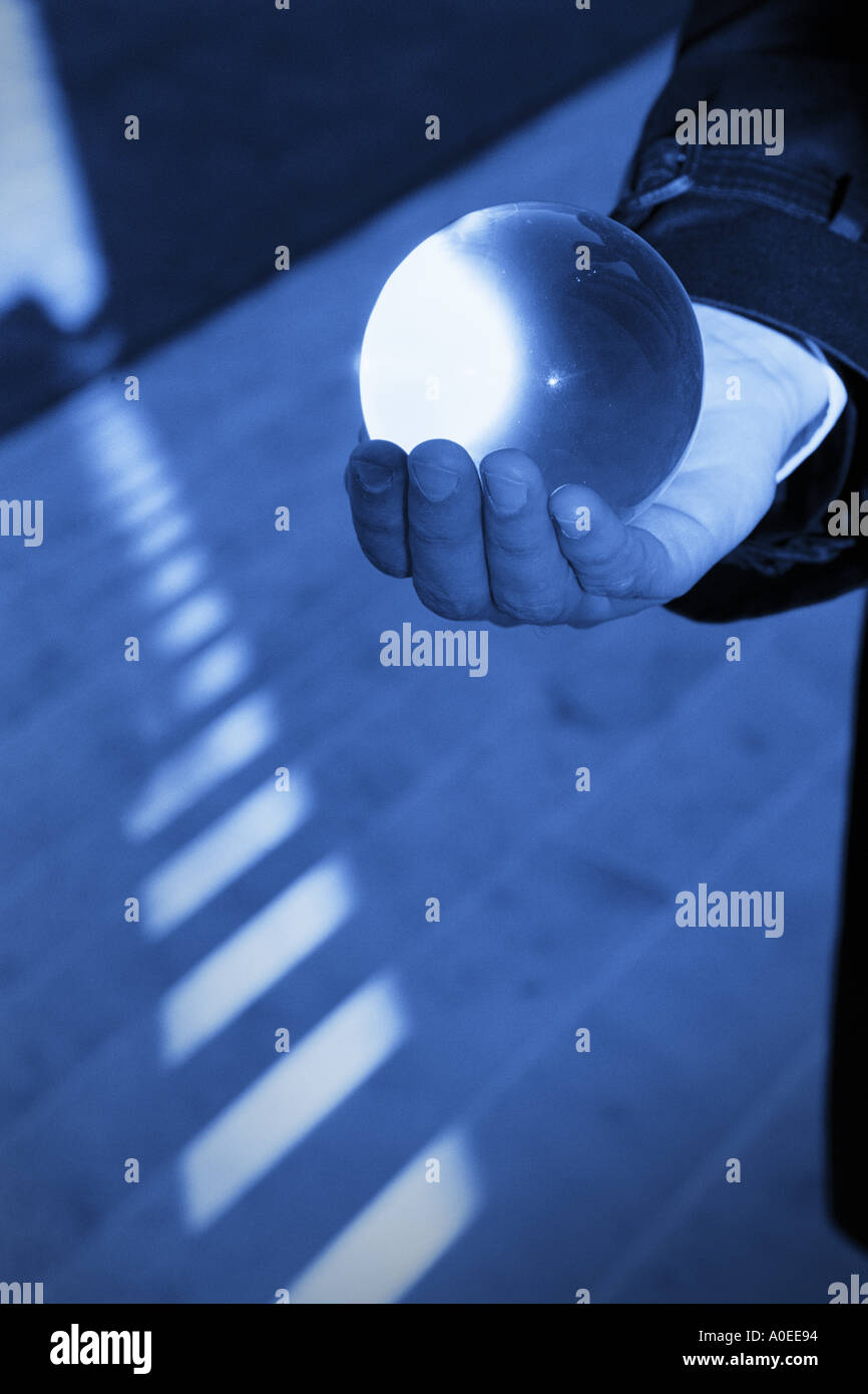 man holding crystal ball Stock Photo - Alamy
