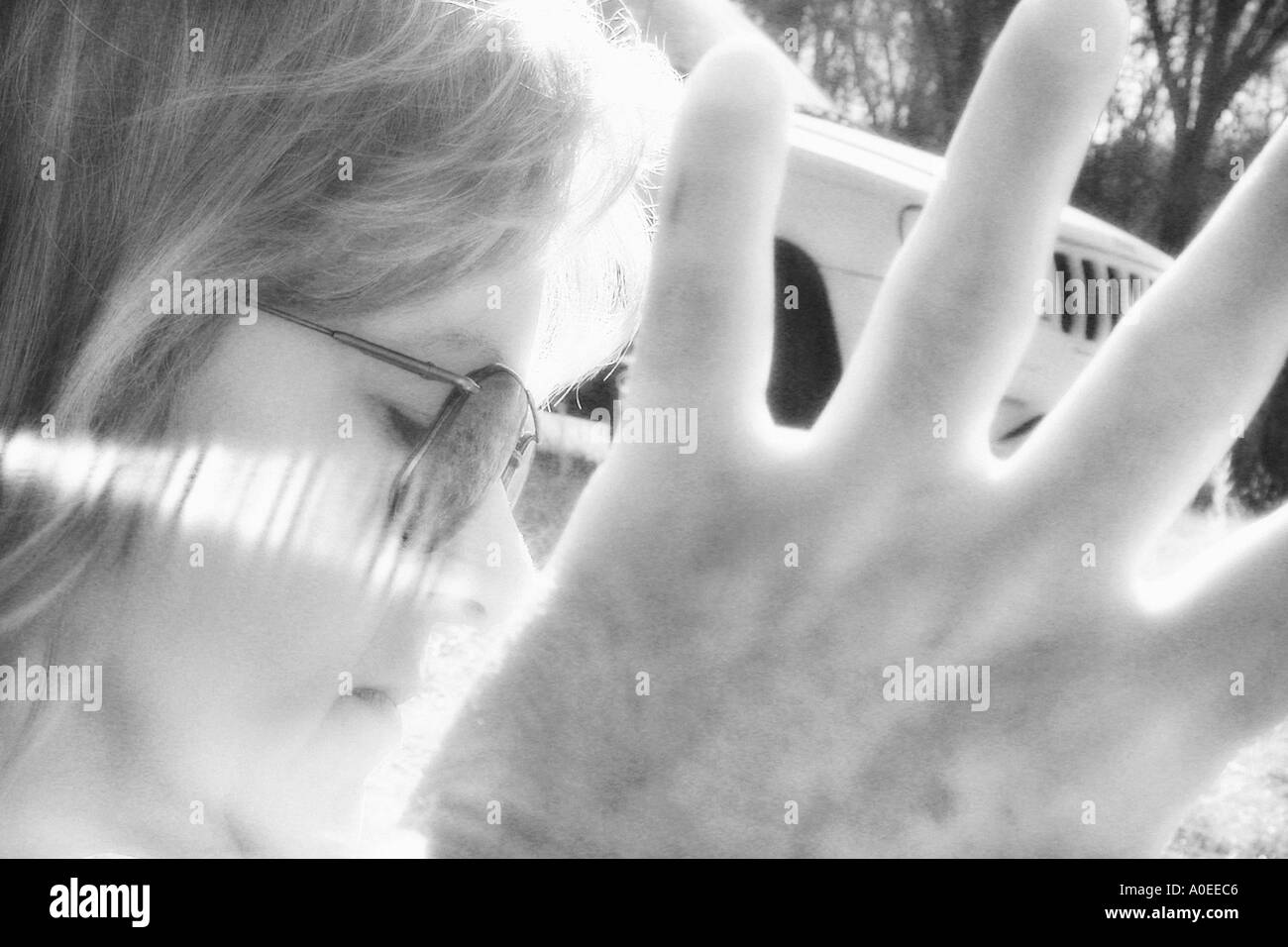 woman with hand in front of face Stock Photo - Alamy