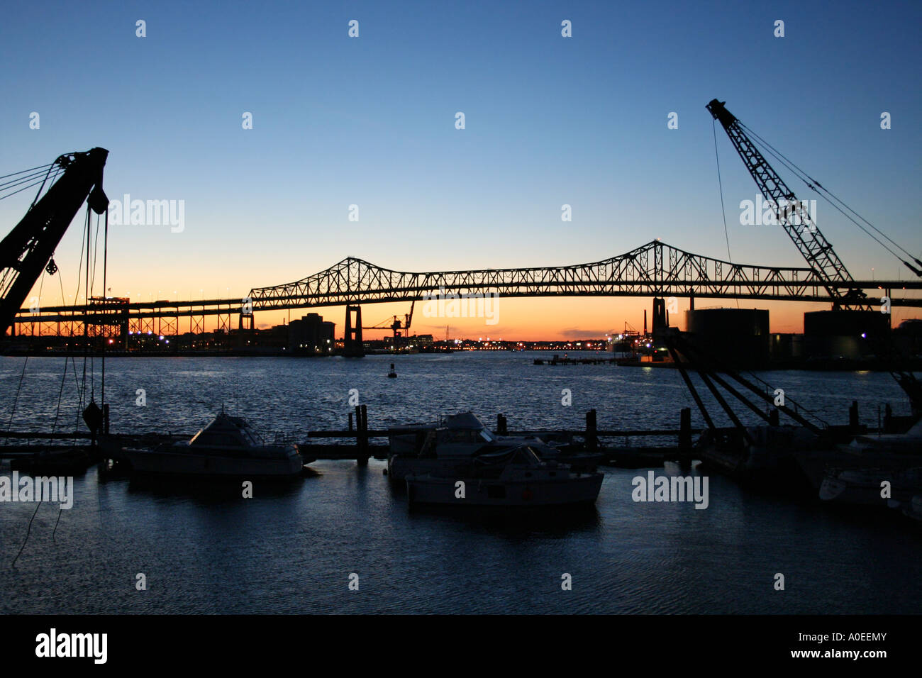 silhouettes of cranes and Tobin Bridge Boston at sunset October 2006 ...