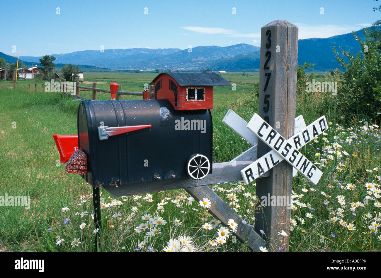 Railroad crossing sign on a mailbox decorated as a train near Steamboat ...