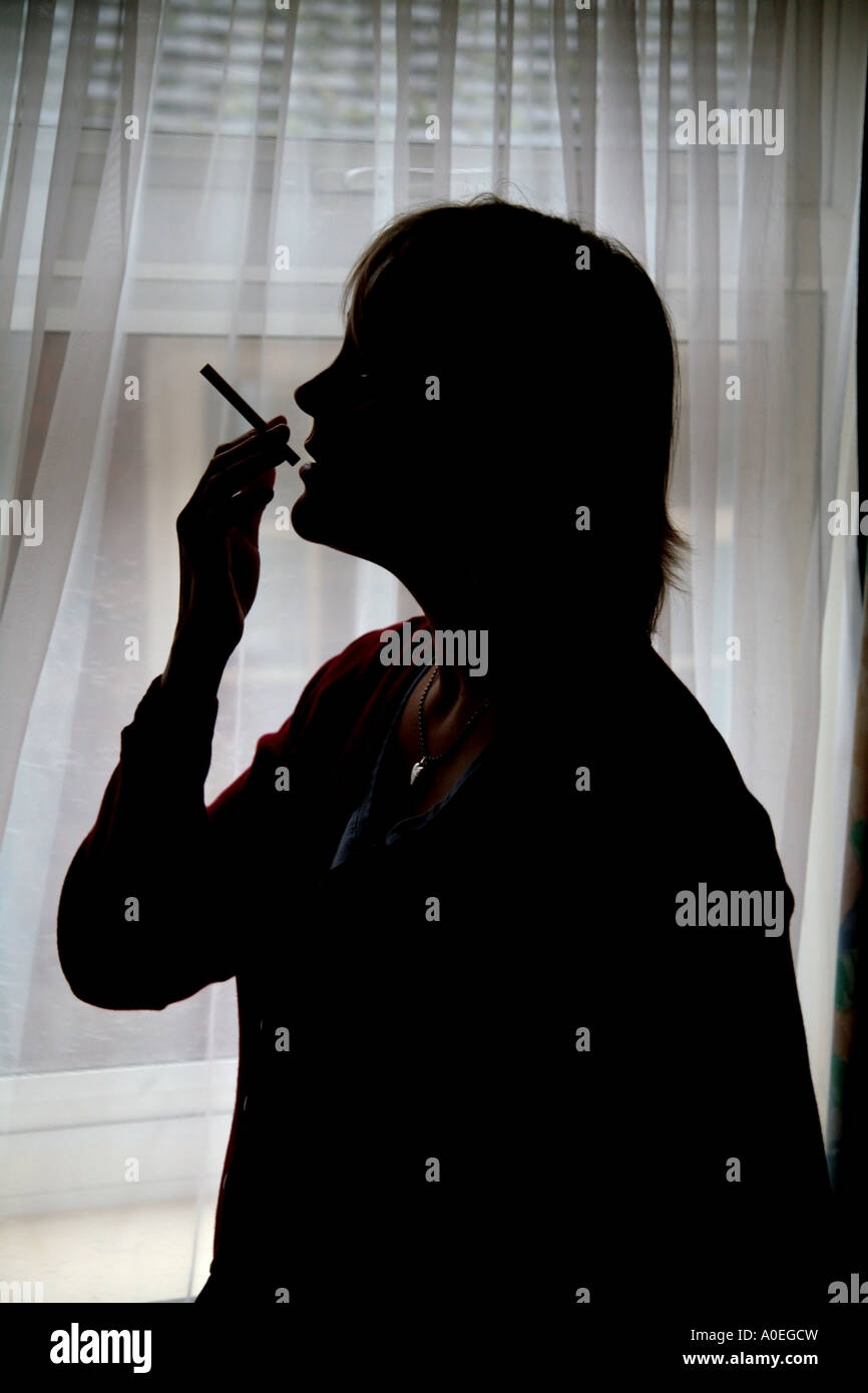 silhouette of woman smoking Stock Photo - Alamy