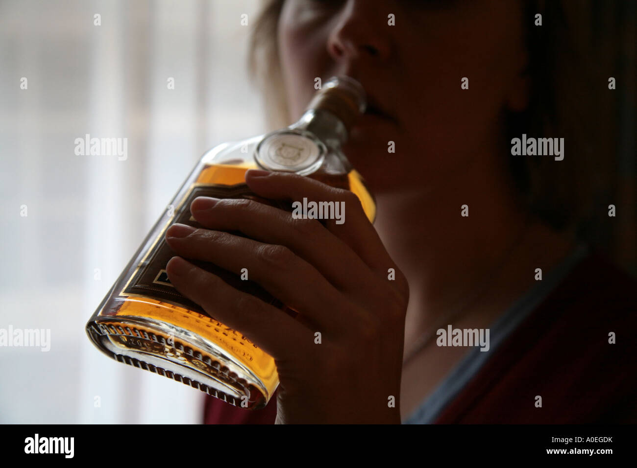 Woman drinking from bottle alcohol hi-res stock photography and images ...