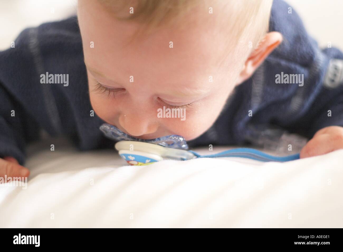 baby with comforter Stock Photo - Alamy