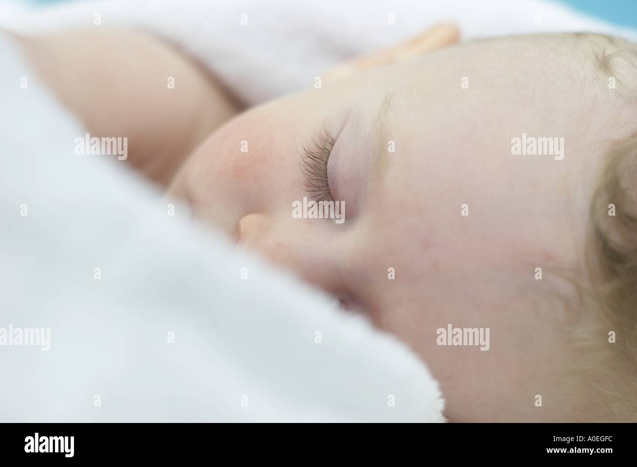 sleeping baby / white terry cloth Stock Photo - Alamy