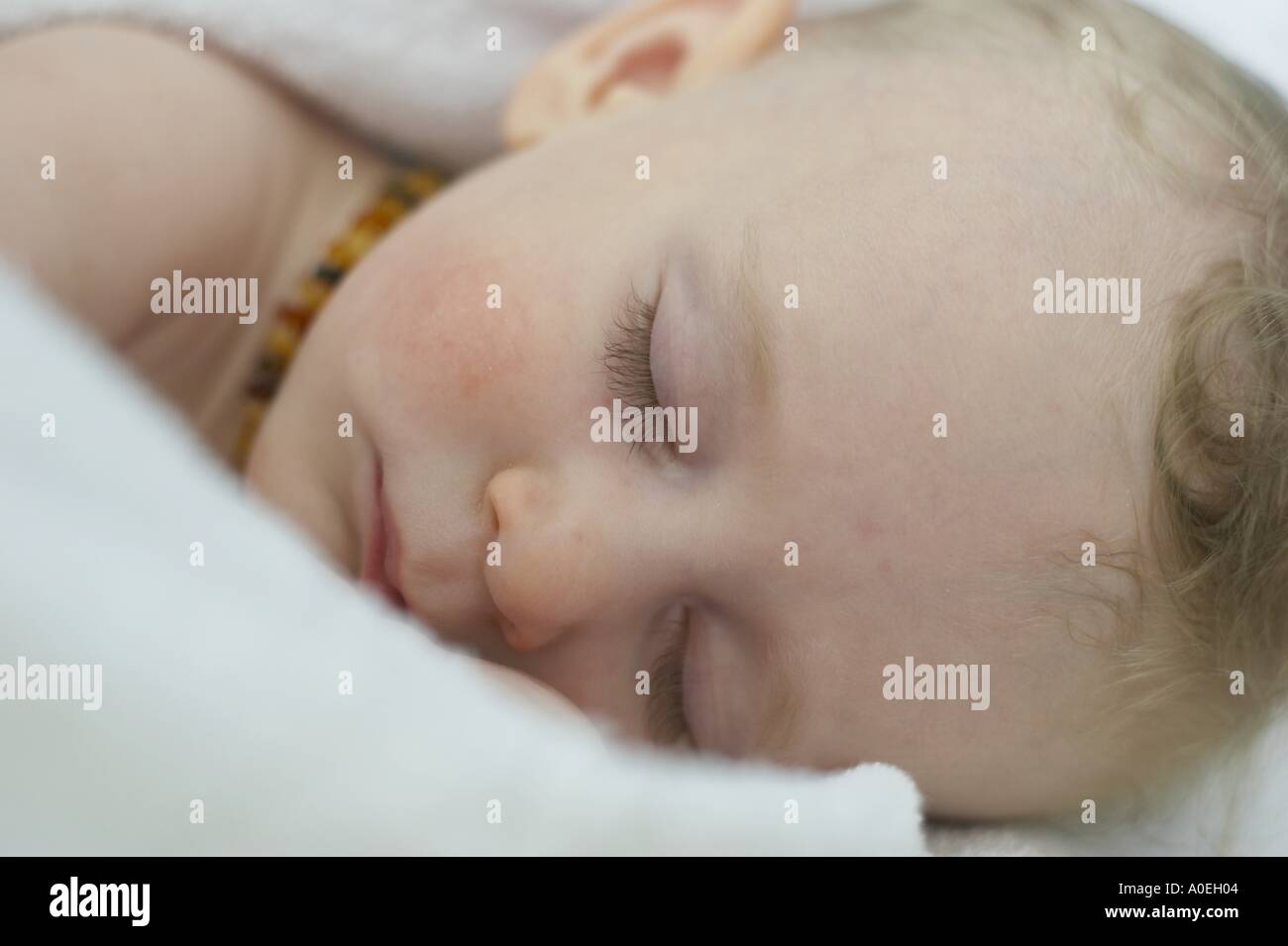 sleeping baby / white terry cloth Stock Photo - Alamy