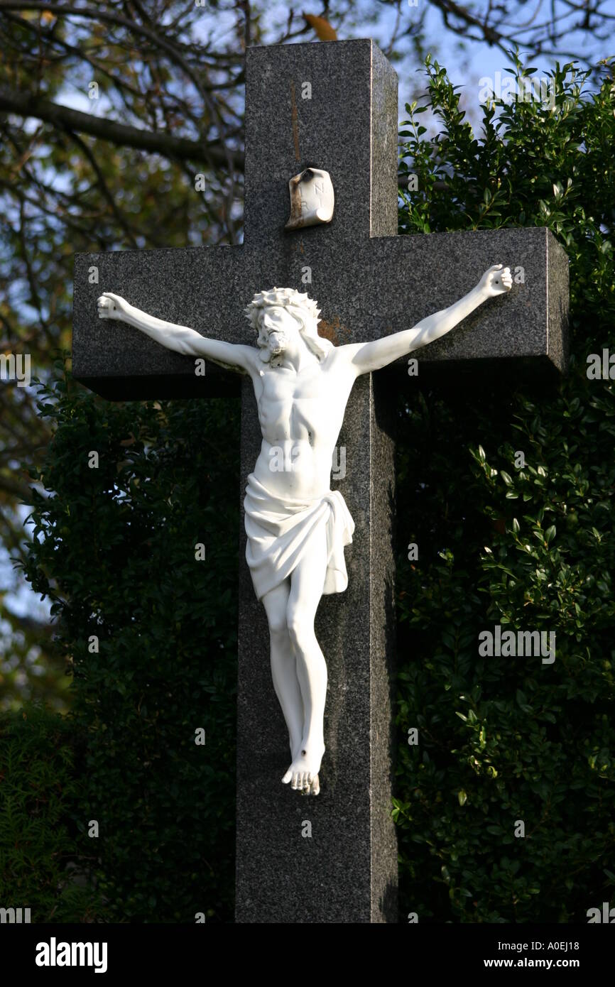 stone cross with crucified Jesus Stock Photo - Alamy