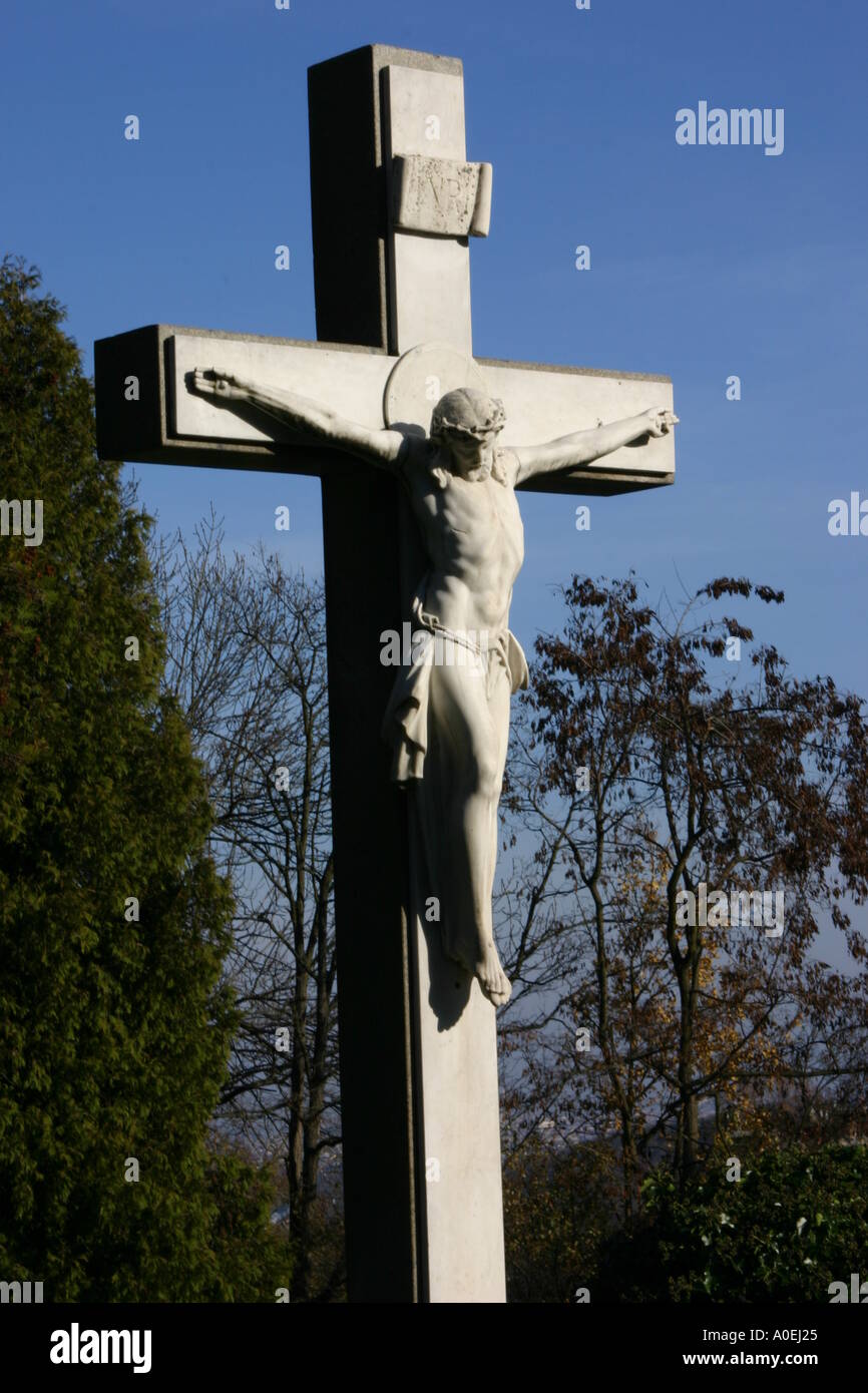stone cross with crucified Jesus Stock Photo - Alamy