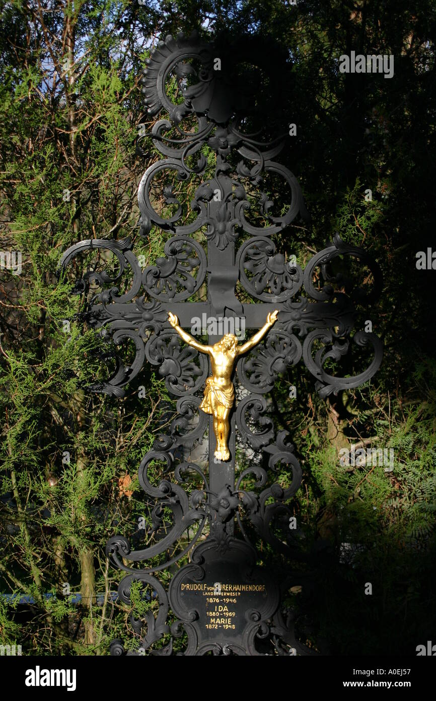wrought iron cross with golden Jesus Stock Photo - Alamy
