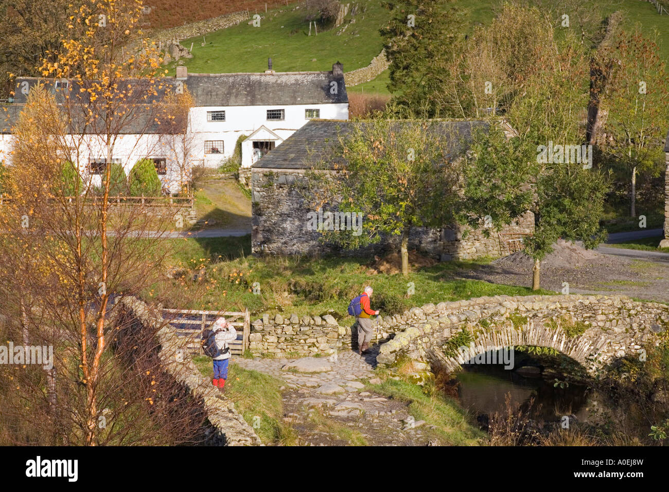 Old stone arch packhorse bridge over Watendlath beck in Lake District ...
