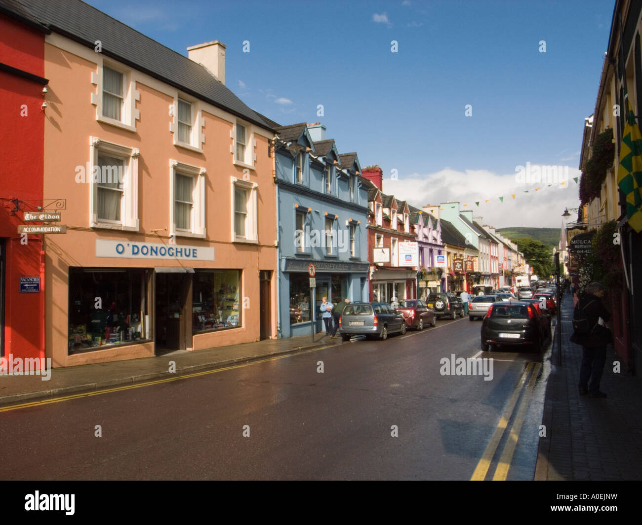 Colourful buildings restaurants shops on main street in attractive town ...
