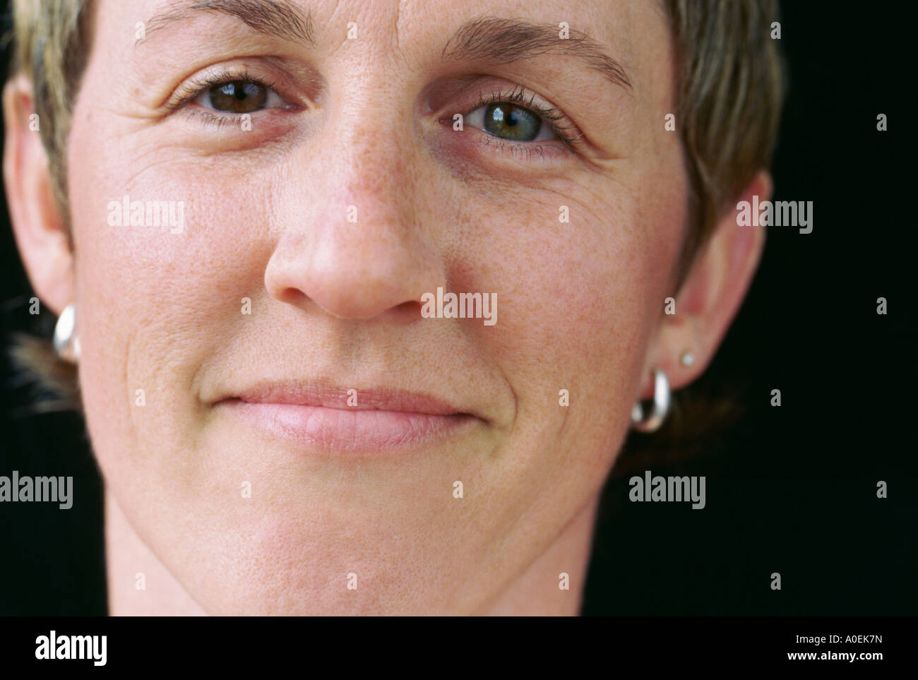 Slightly smiling face hi-res stock photography and images - Alamy