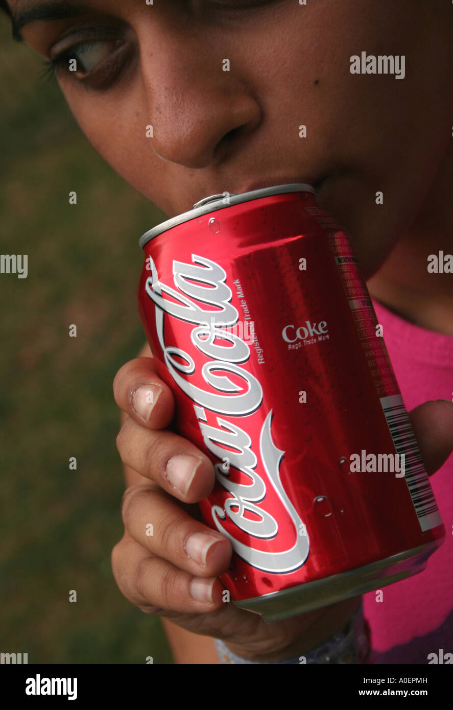 Women Drinking a Can of Coca Cola Stock Photo - Alamy