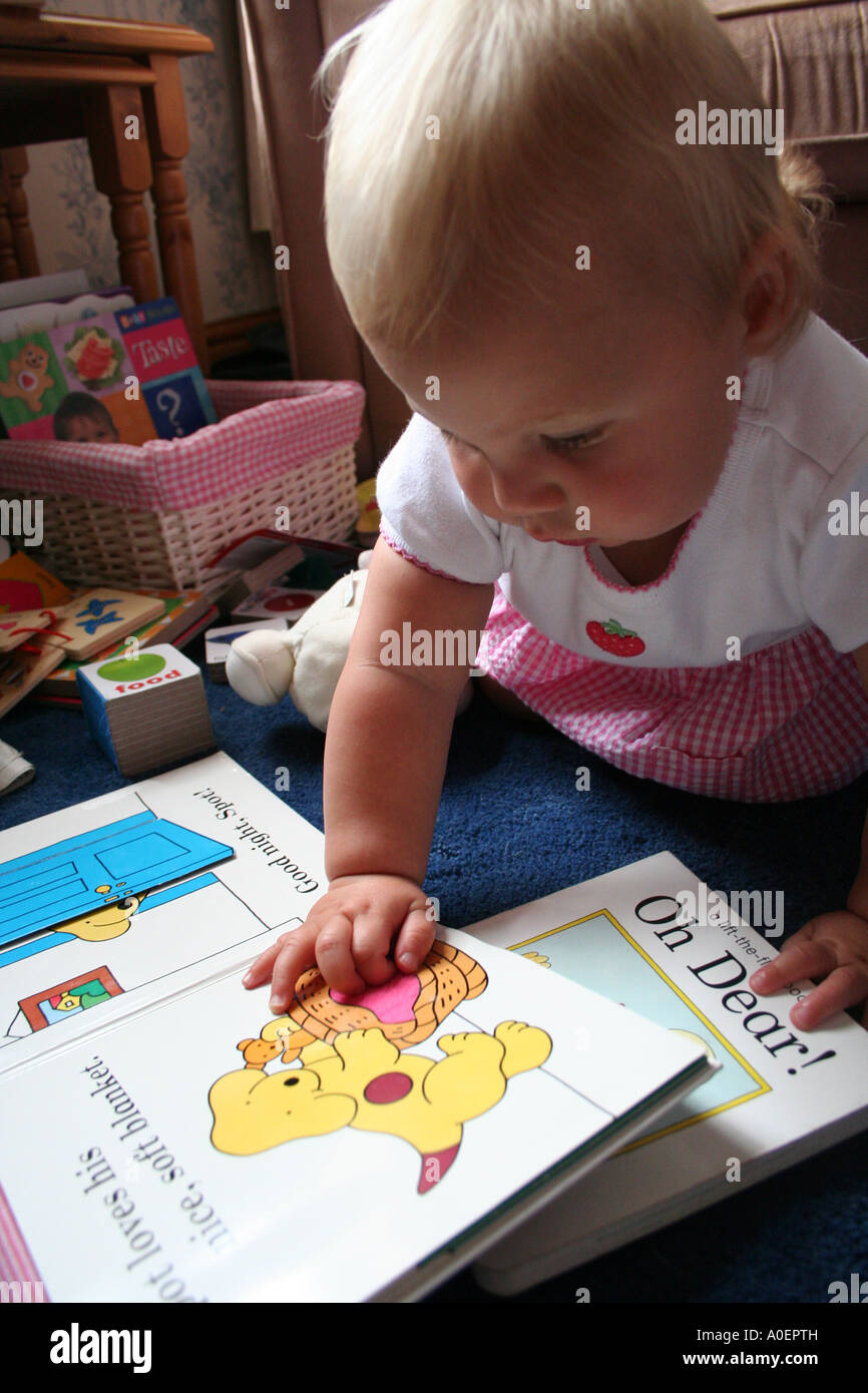 Young Child Reading Book Stock Photo - Alamy