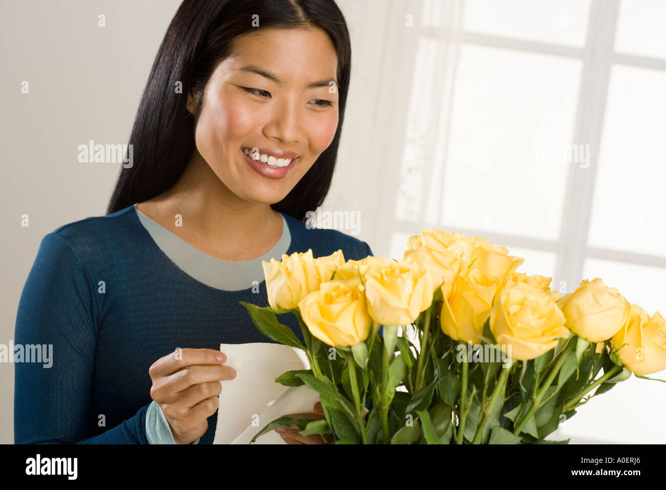 One woman admiring flowers hi-res stock photography and images - Alamy