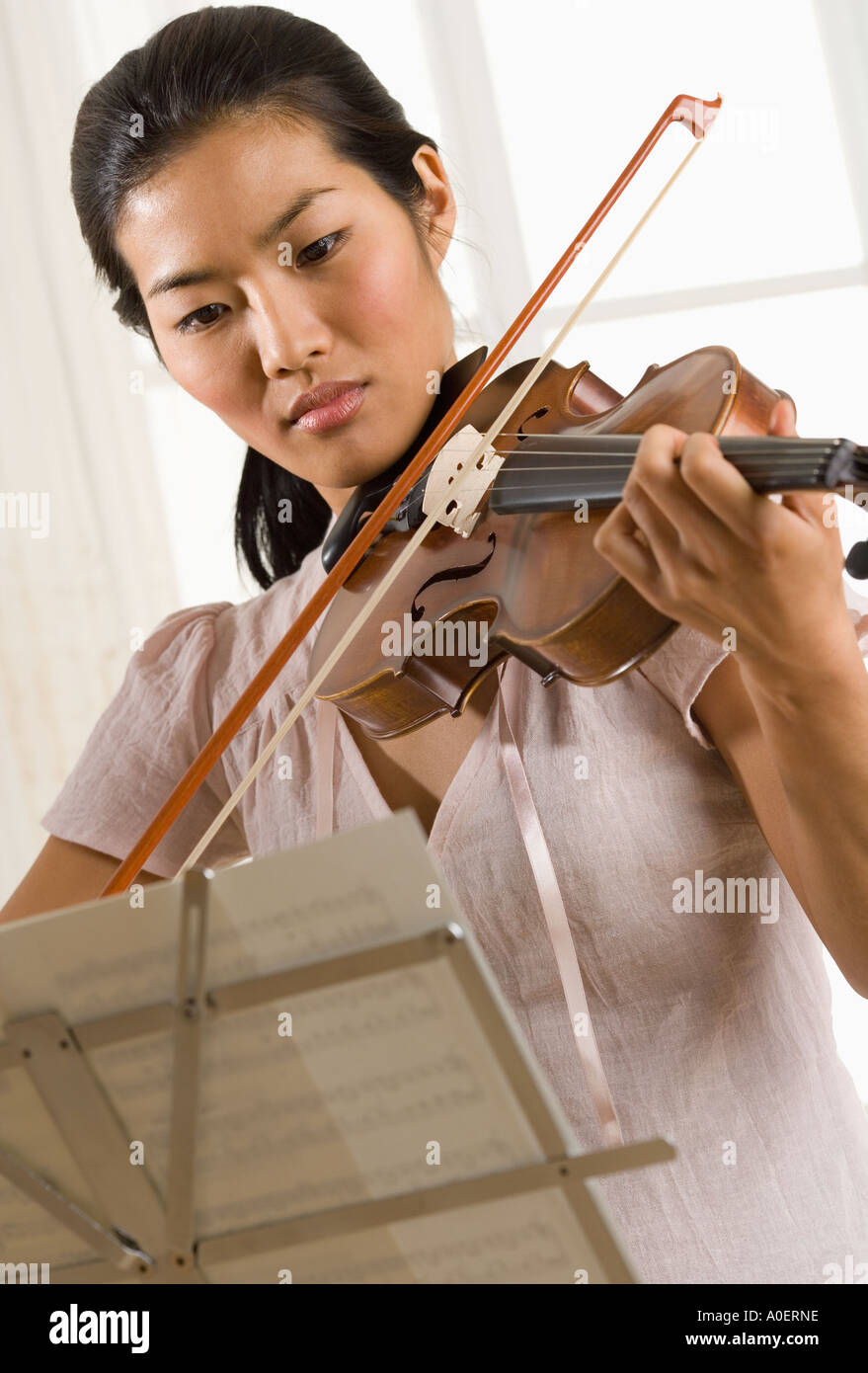 Female asian violinist playing violin hi-res stock photography and ...