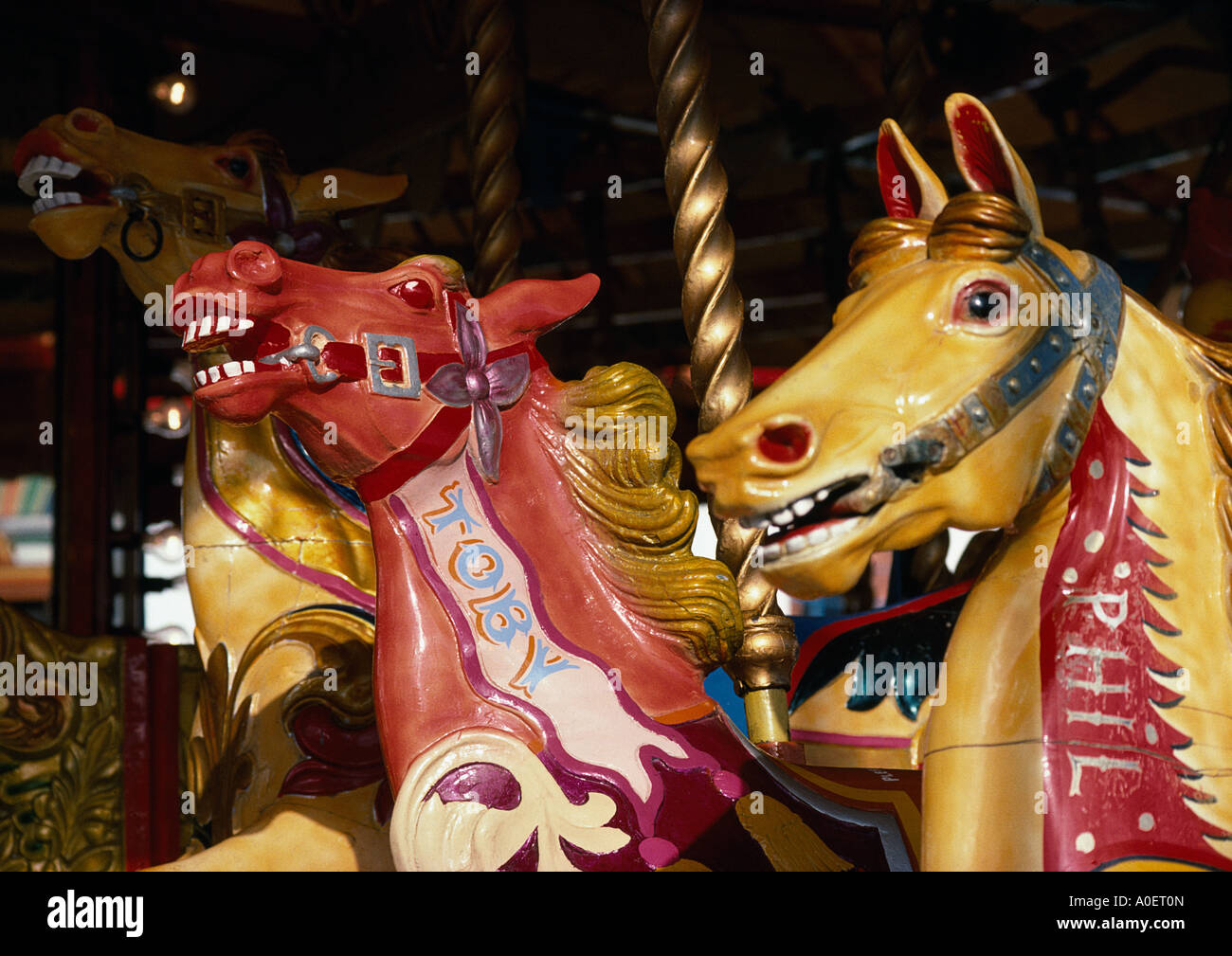BRIGHTLY COLOURED FAIR GROUND CARNIVAL ROUNDABOUT HORSES Stock Photo ...