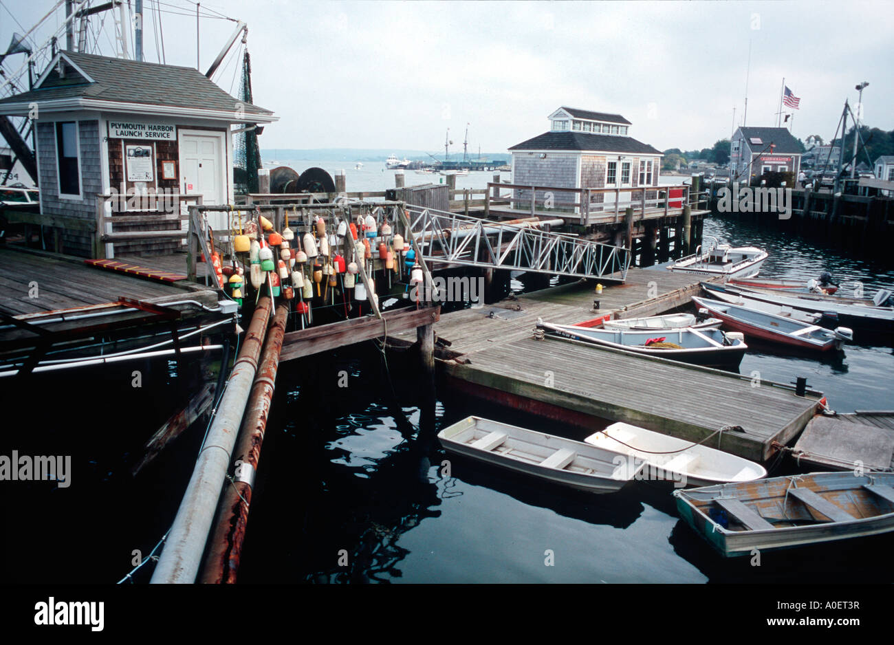Fishing floats next to the Launch Service building at Plymouth harbour ...