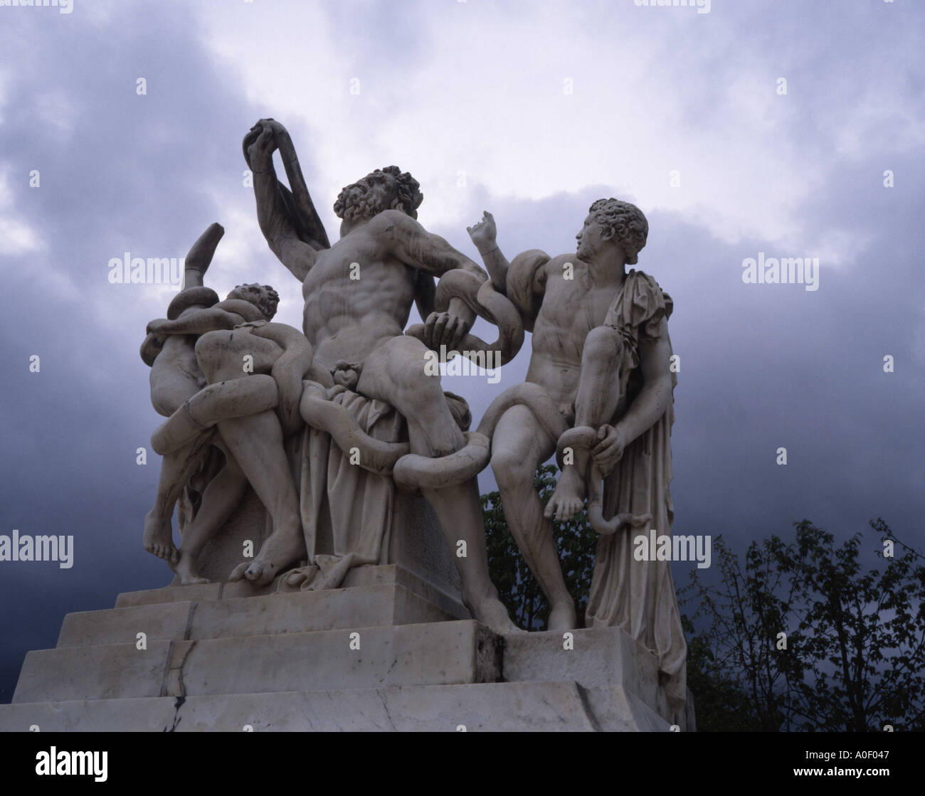 Statue group of men in gardens of Versailles, France Stock Photo - Alamy
