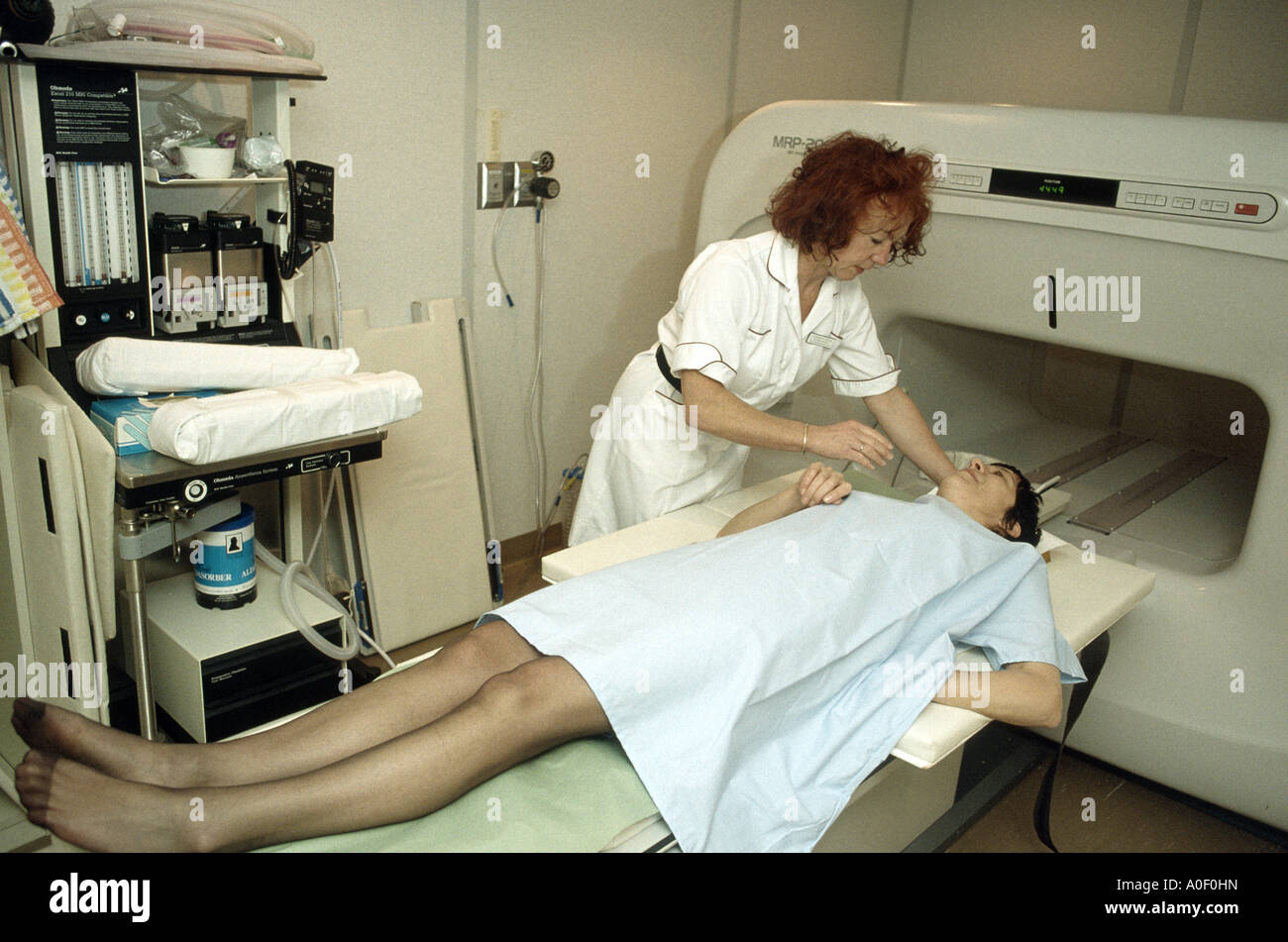 A nurse placing a patient on MRI scanner Stock Photo - Alamy