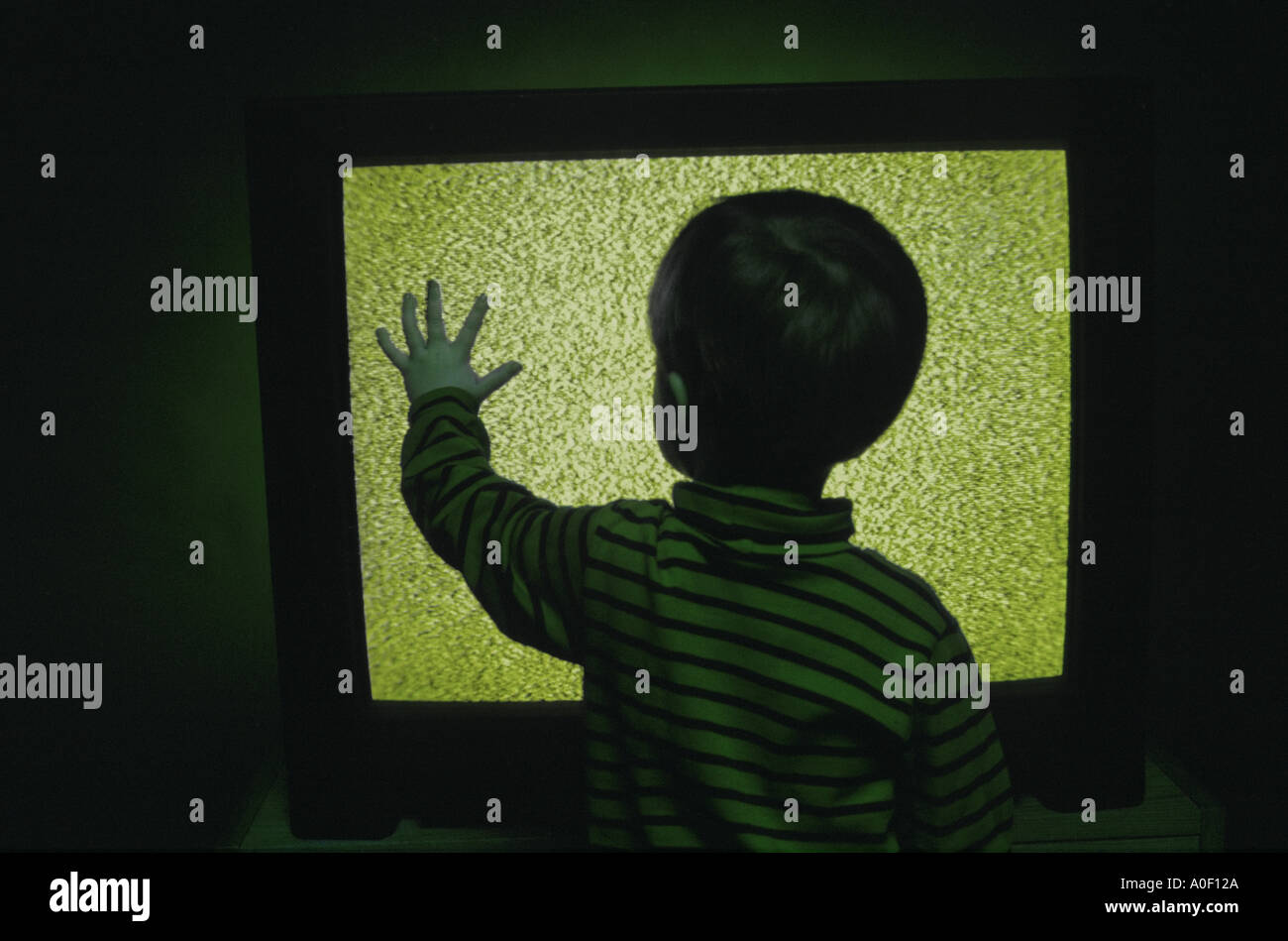 Boy touching tv screen hi-res stock photography and images - Alamy
