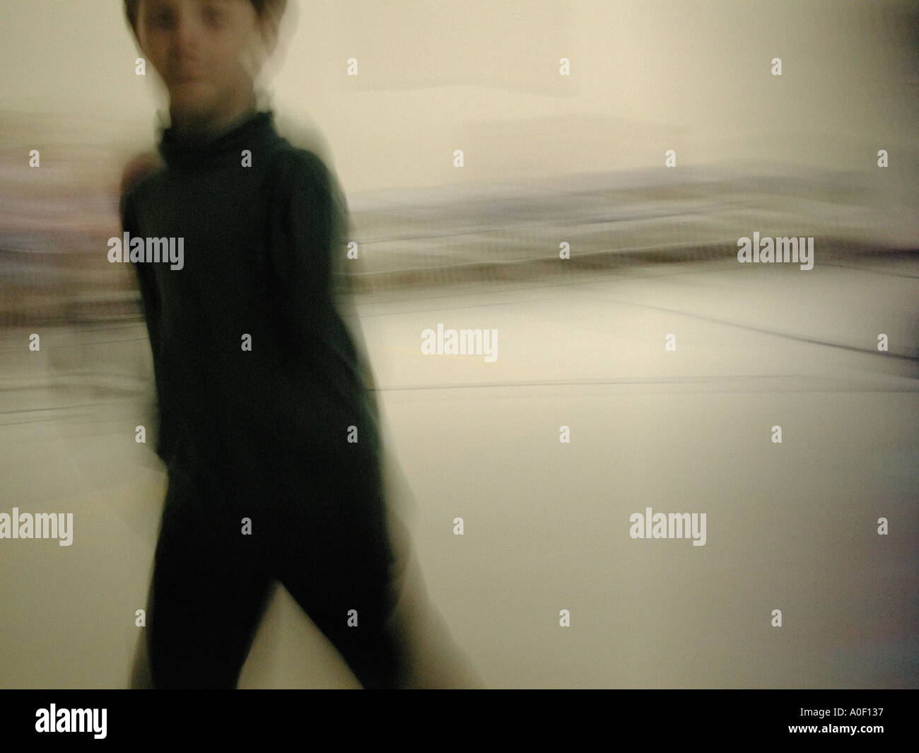 Eight year old boy running inside school VA USA Stock Photo - Alamy