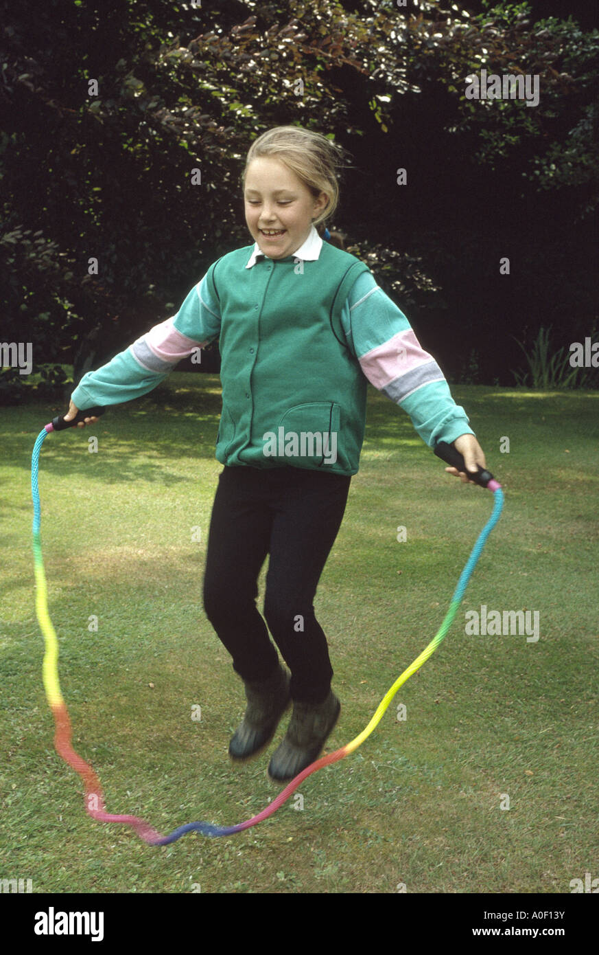young girl skipping Stock Photo - Alamy