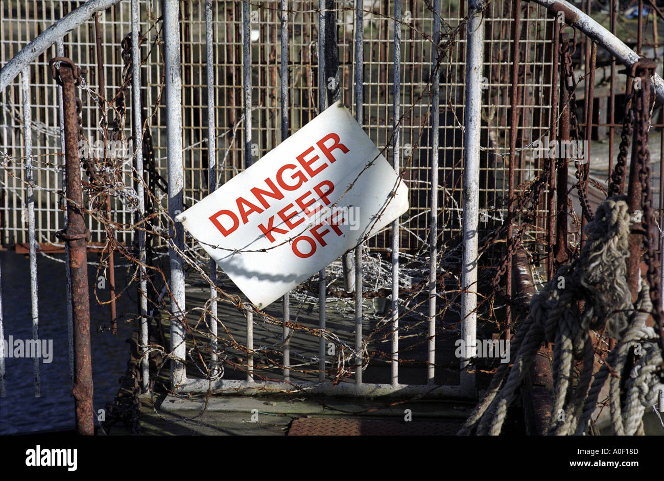 Danger sign on gate Stock Photo - Alamy
