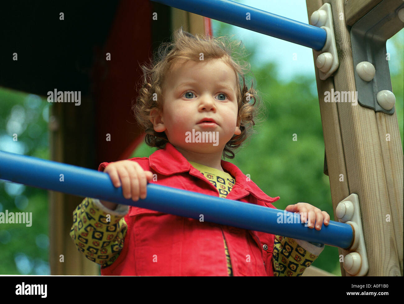 child young girl looks look face playground curly hair curl play summer ...