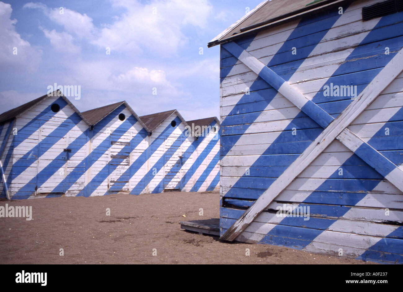 Stripy blue beach huts hi-res stock photography and images - Alamy