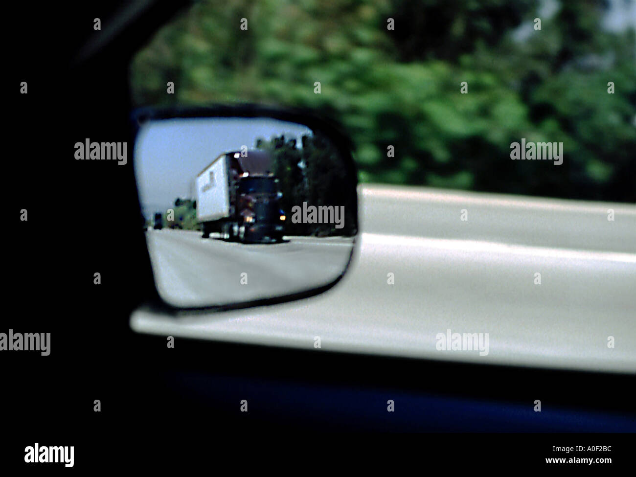 Reflection of semi truck in car side mirror Stock Photo - Alamy