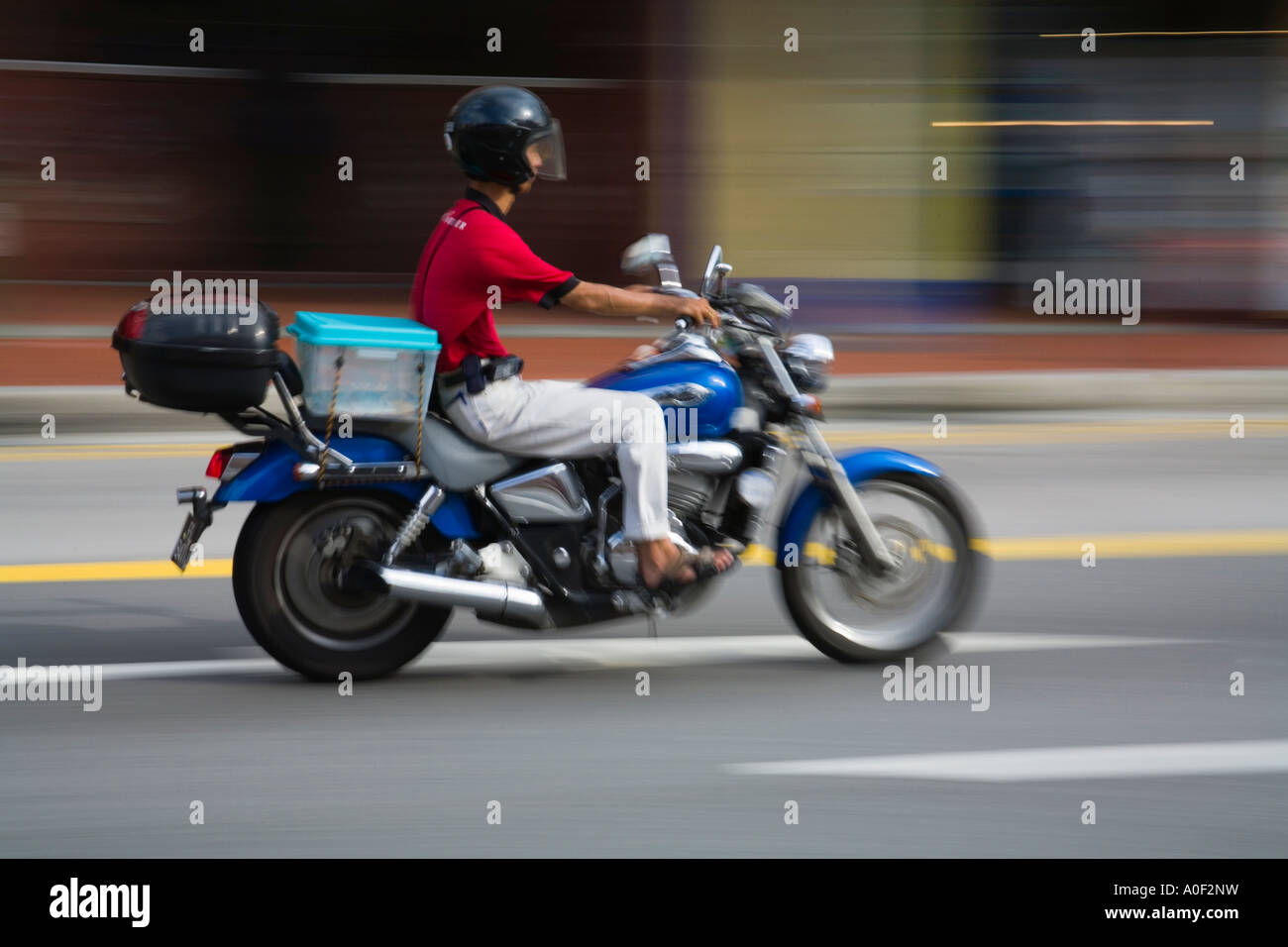 Motorcycle rider; city street Stock Photo - Alamy