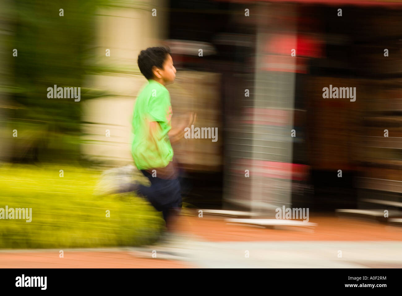 Young Boy Running Stock Photo - Alamy