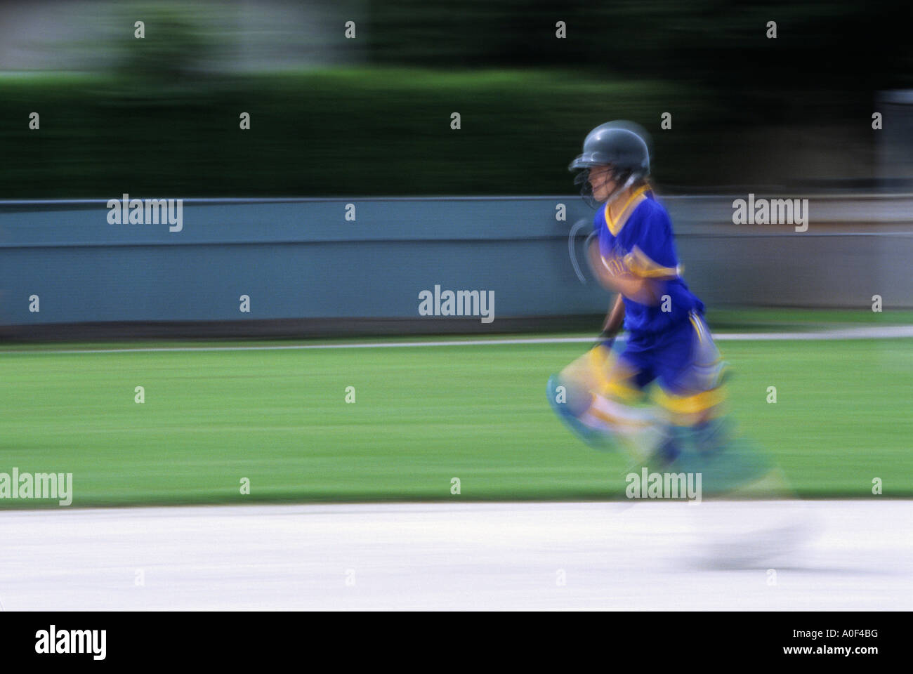 Youth baseball player running Stock Photo - Alamy