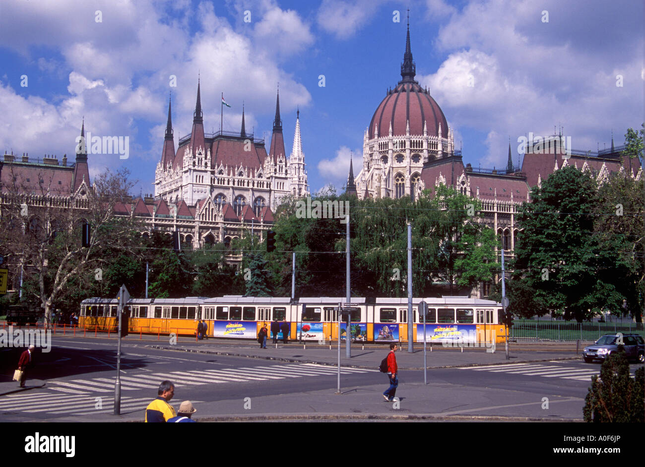 Hungary, Budapest, Pest, One of the familiar yellow city trams passing ...