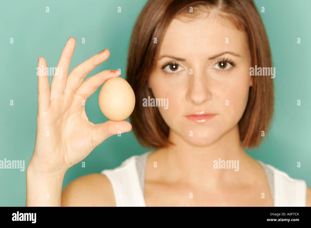 Woman with egg hi-res stock photography and images - Alamy