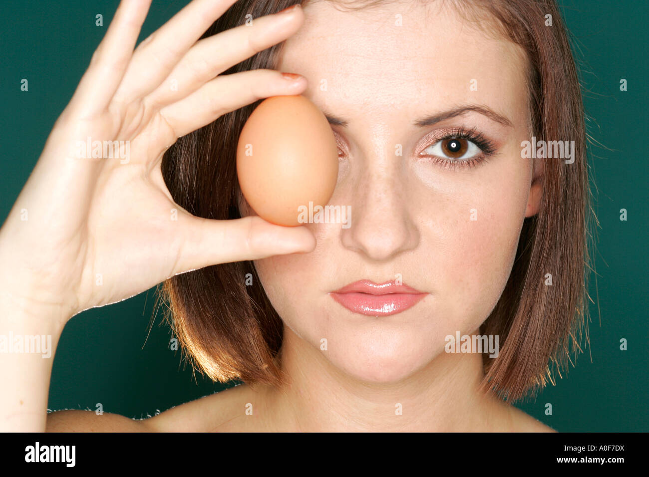 Woman with egg hi-res stock photography and images - Alamy