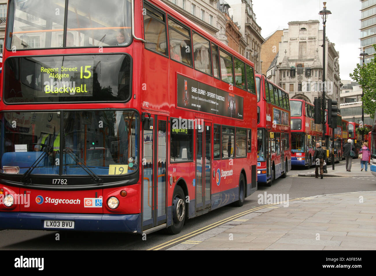 A line of London buses nose to tail in stationary traffic Stock Photo ...