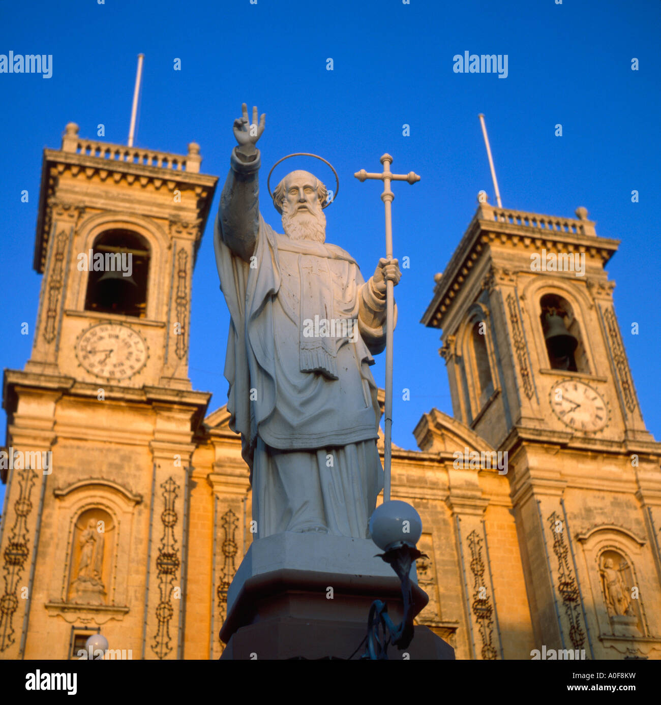 Statue of St Phillip outside Zebbug church at dusk Malta Stock Photo ...