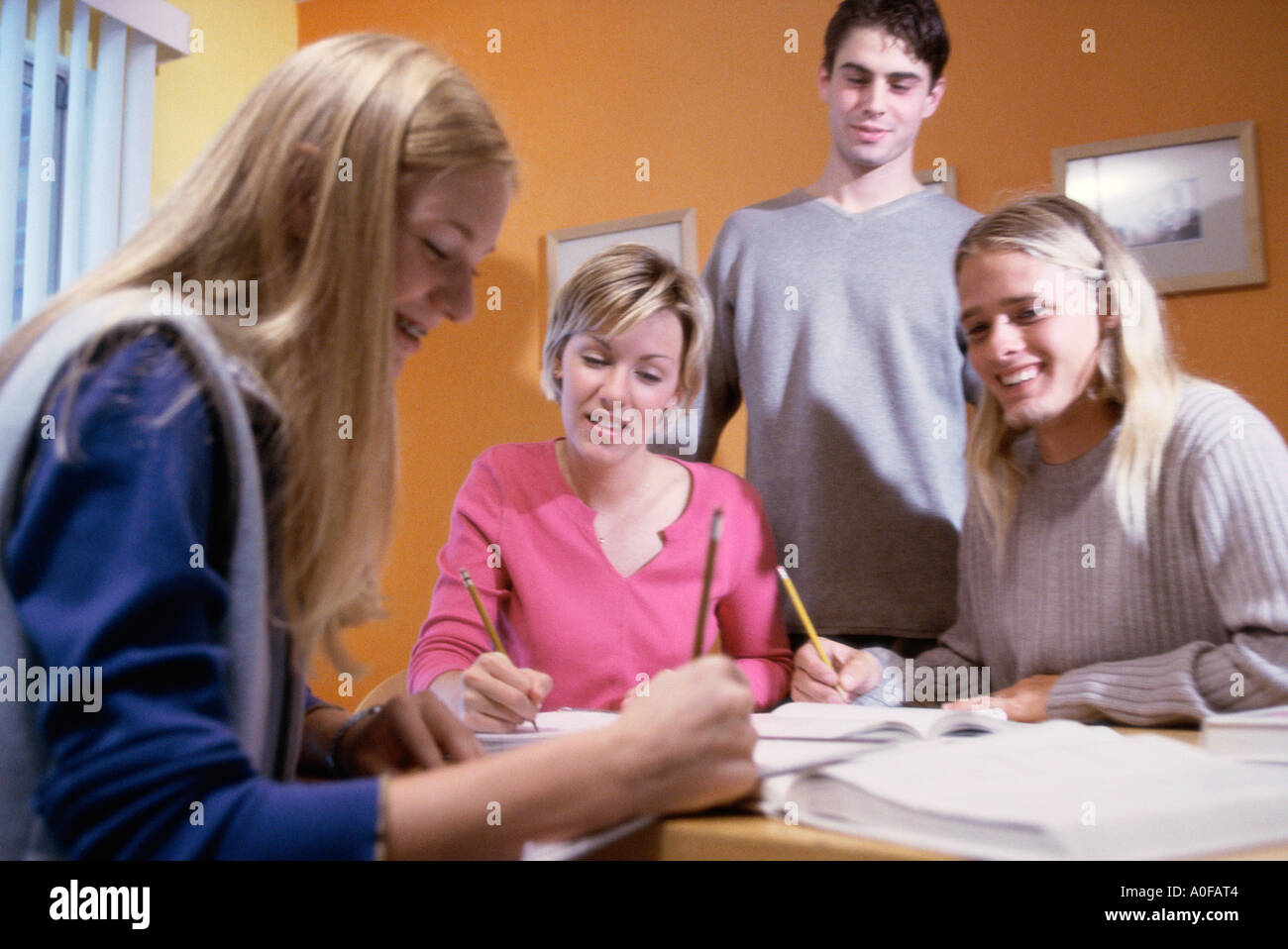 Group of teenagers studying together Stock Photo - Alamy
