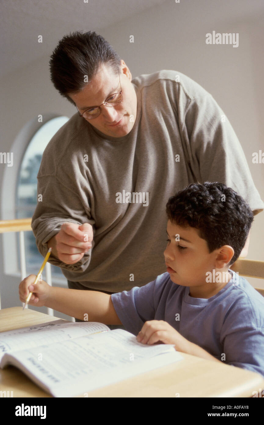 Father helping his son with homework Stock Photo - Alamy