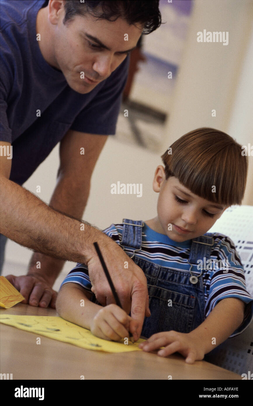 Father teaching his child Stock Photo - Alamy